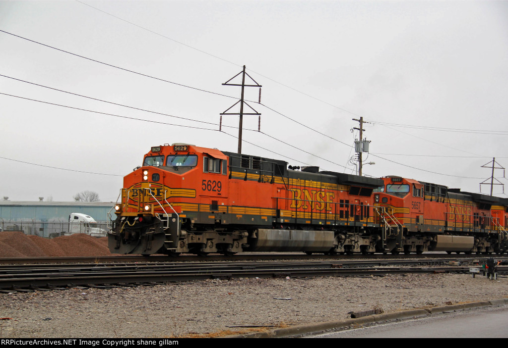 BNSF 5629 leads a Huge grain into Madison IL.